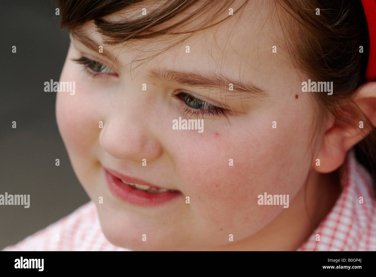 Pretty young student, in uniform, aged seven Stock Photo - Alamy