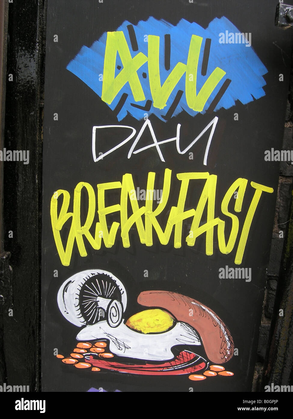 pub sign "all day breakfast" on black background Stock Photo - Alamy