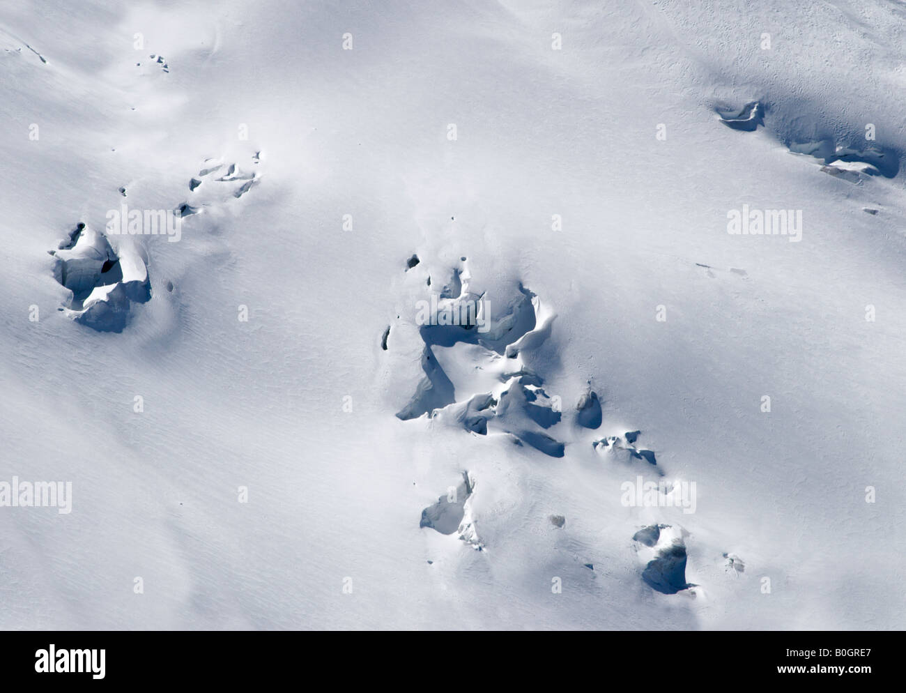 Snow bridges hiding the deep menacing crevasses on glaciated mountain ...