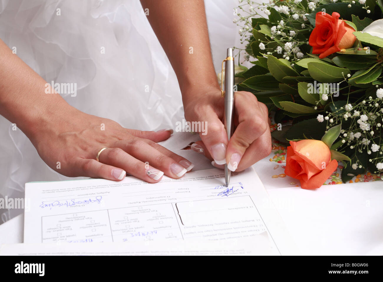 the bride is signing the wedding papers Stock Photo - Alamy
