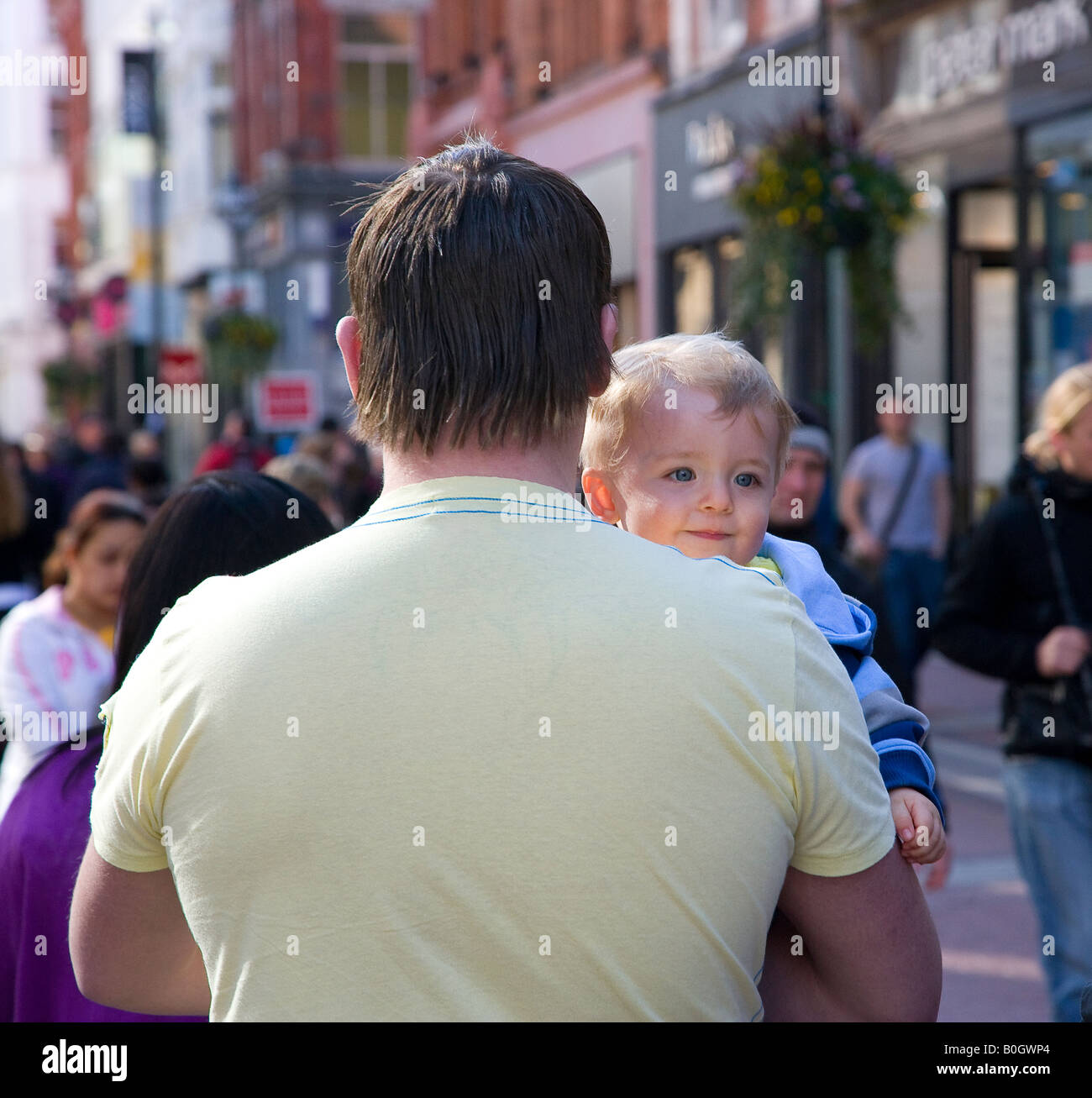 Child being carried hi-res stock photography and images - Alamy