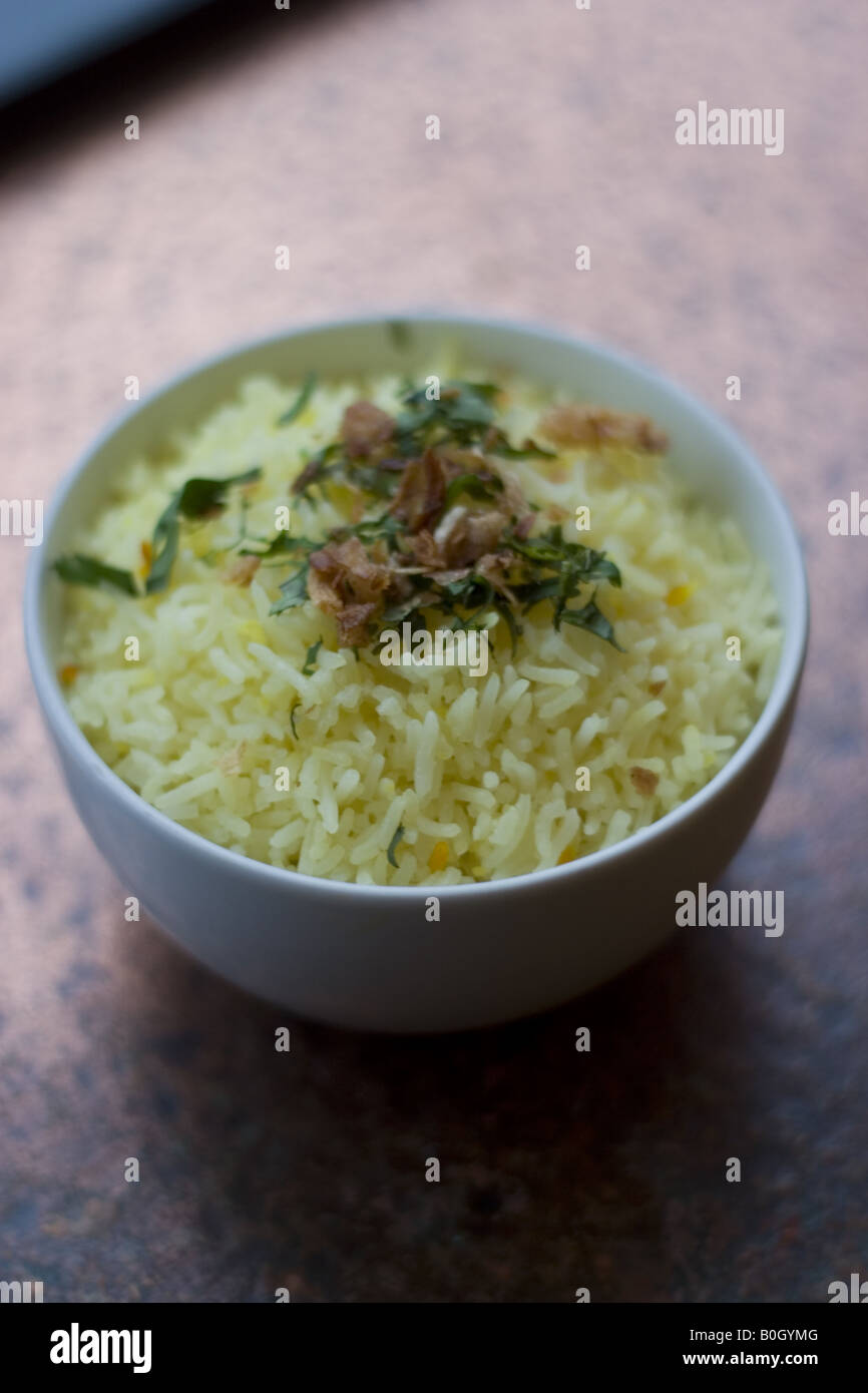 Bowl of yellow rice Stock Photo - Alamy