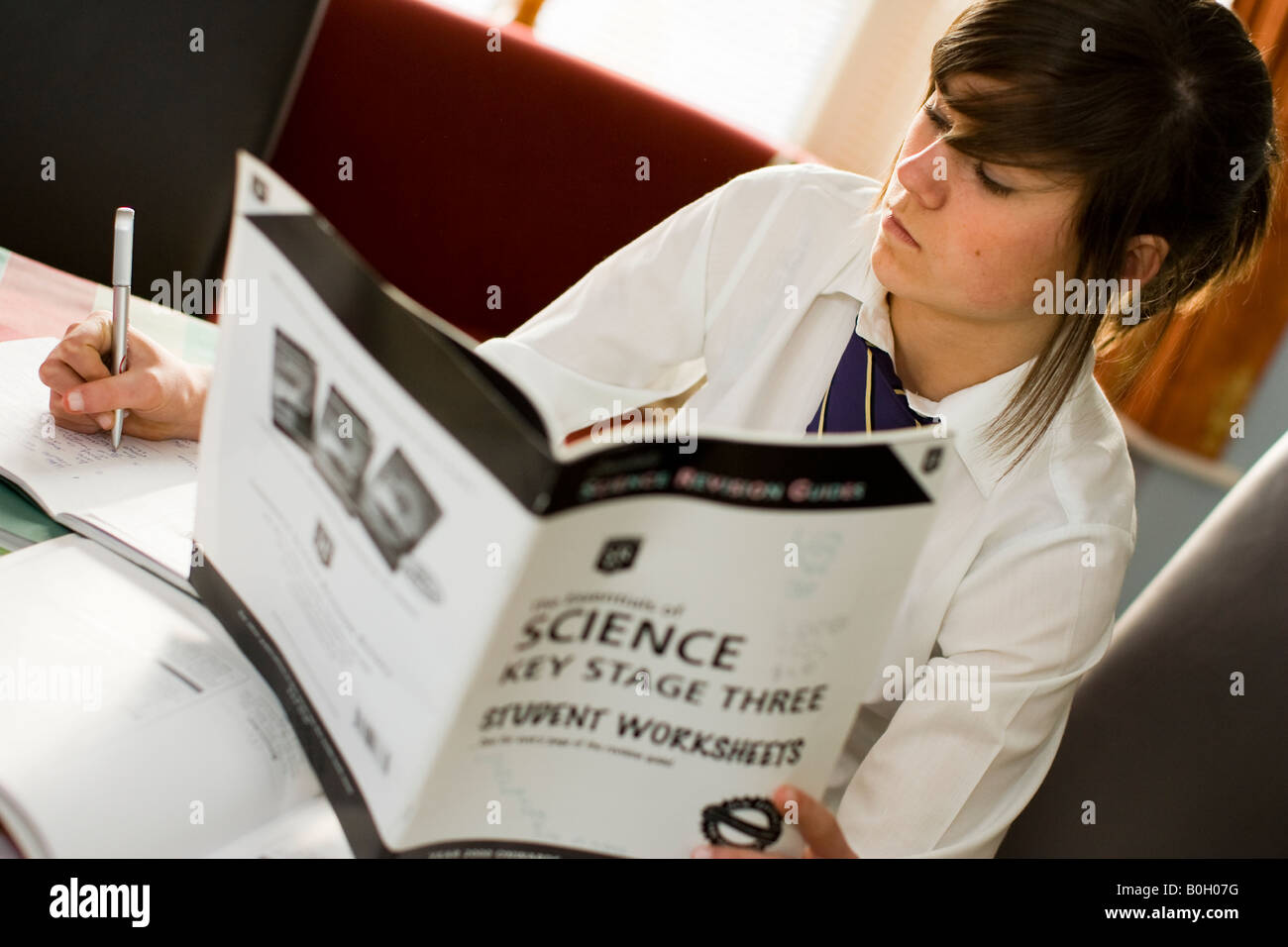 school girl doing science homework Stock Photo - Alamy