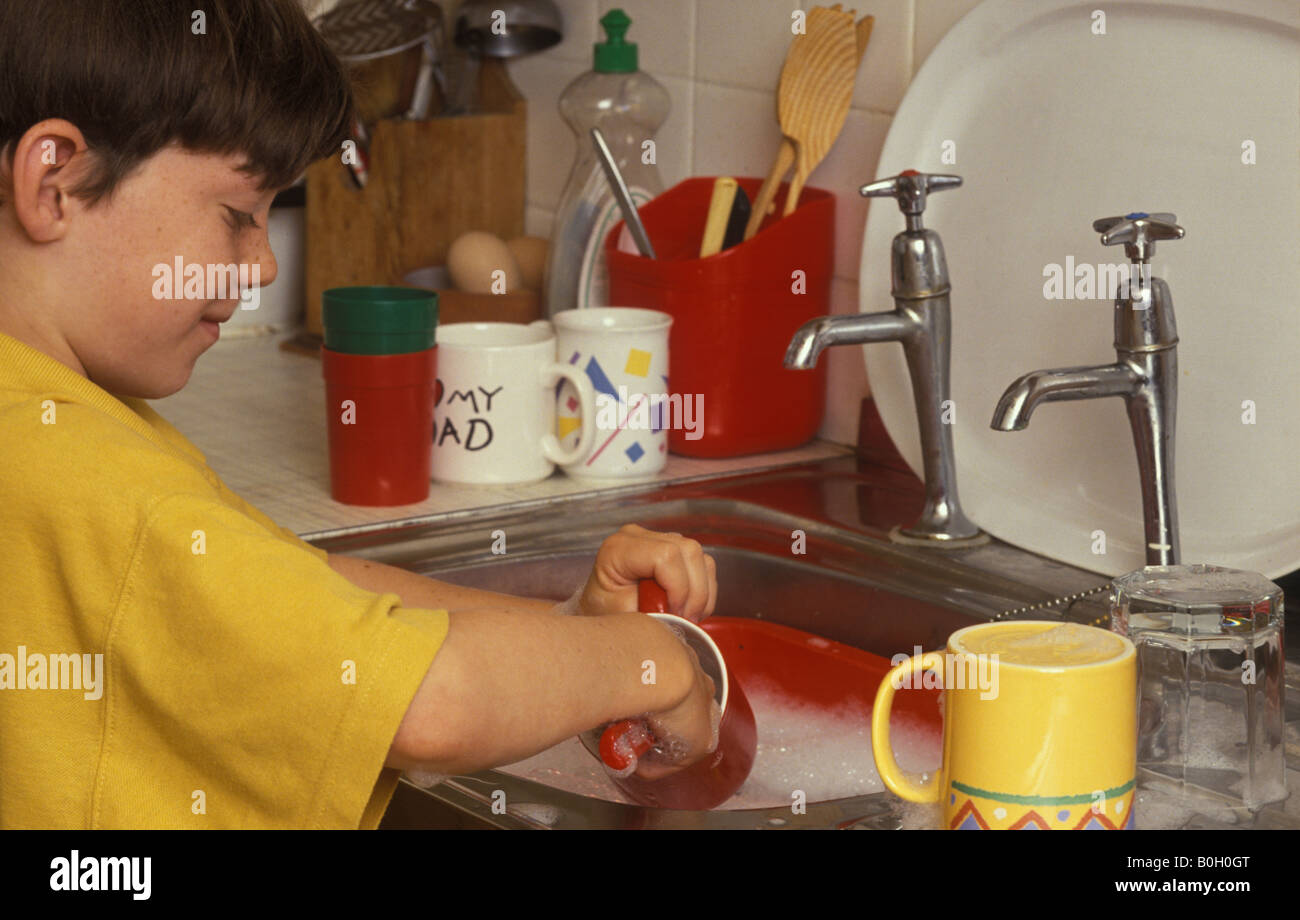 boy doing the washing up Stock Photo - Alamy