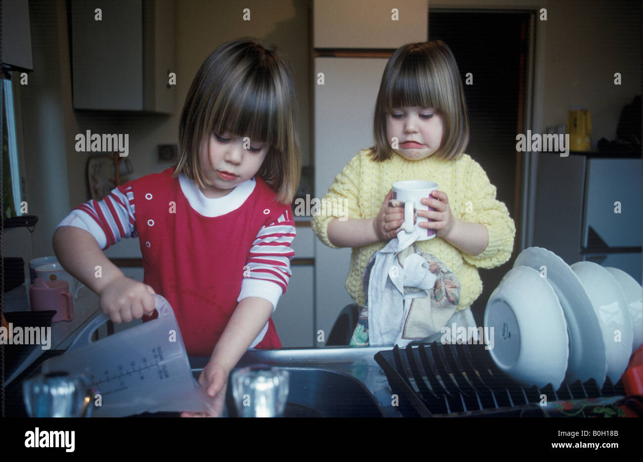 Children washing up hi-res stock photography and images - Alamy