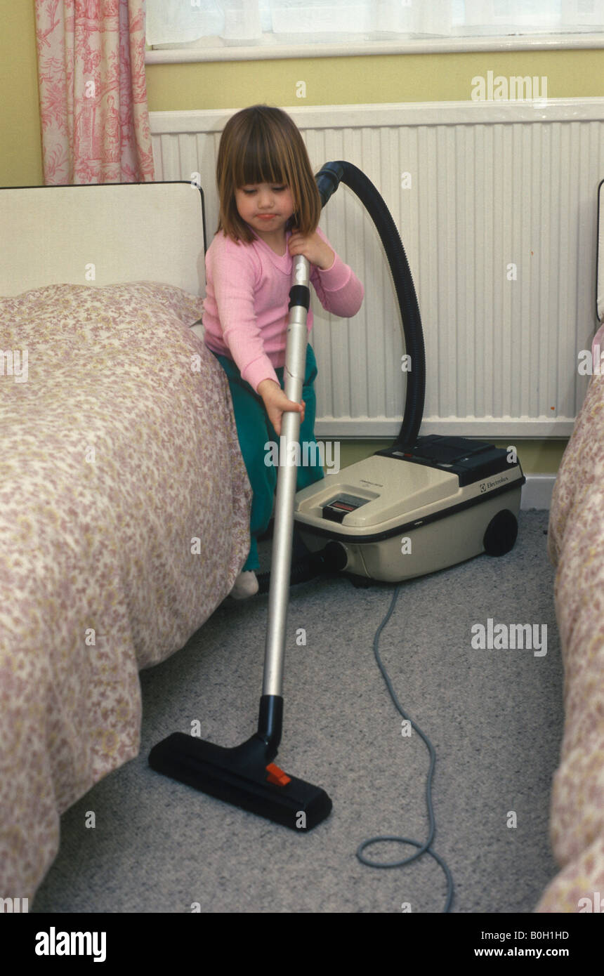 little girl hoovering her bedroom Stock Photo - Alamy