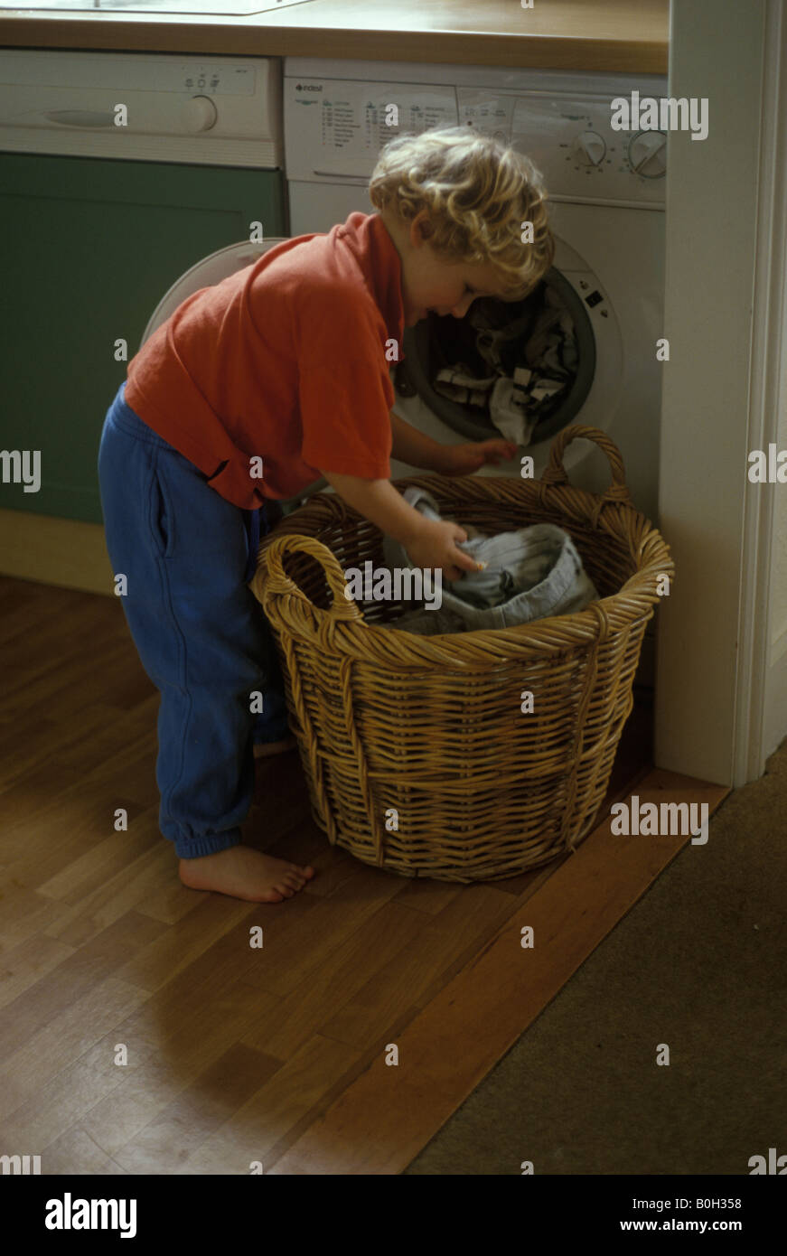 child helping with the laundry Stock Photo - Alamy