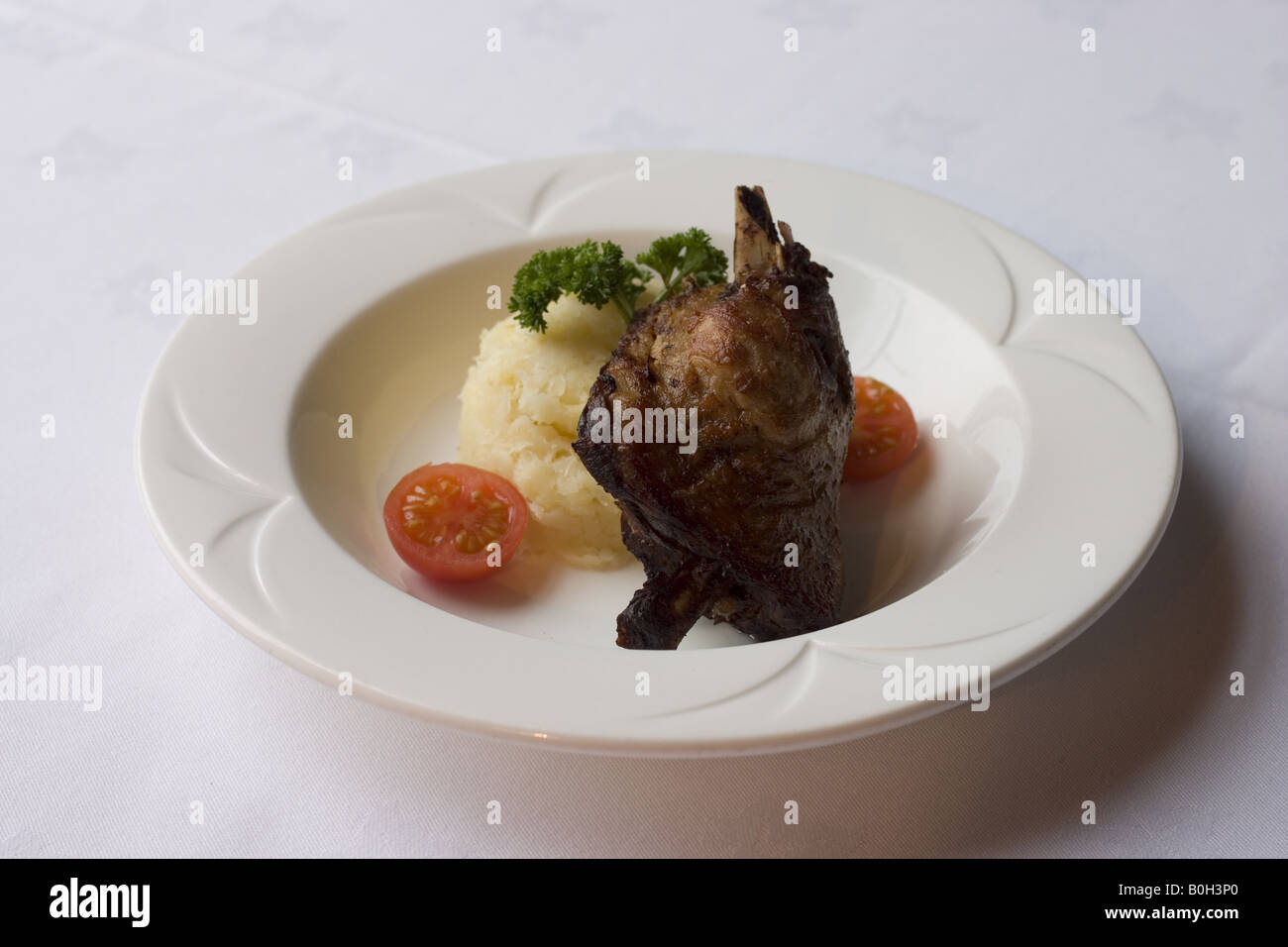 a serving of duck with mashed potato Stock Photo - Alamy