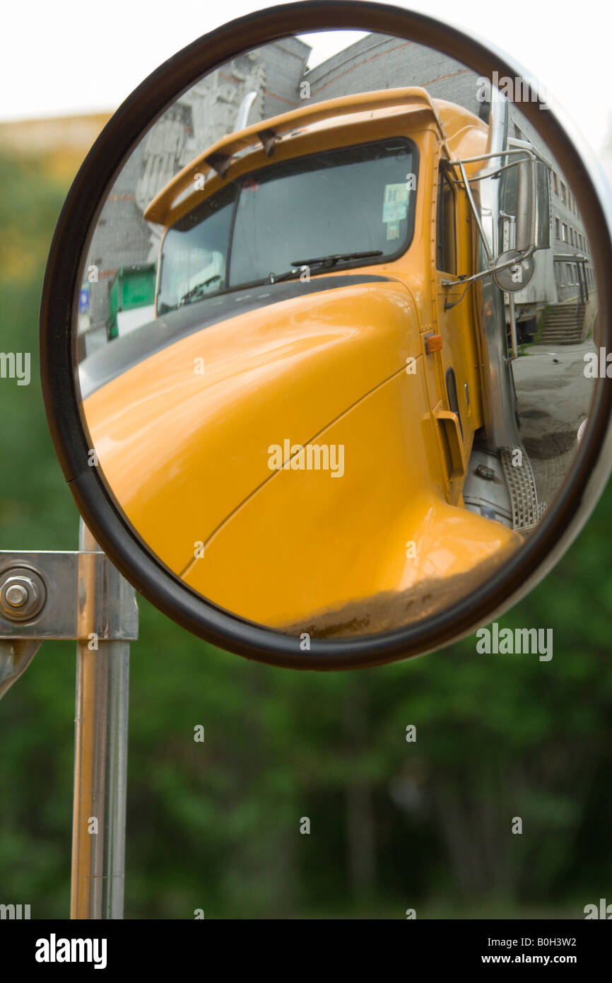 Reflection of yellow long-distance truck in rear-view mirror Stock ...