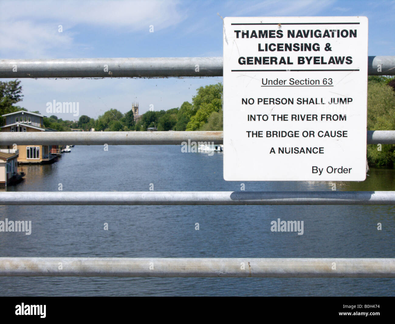 warning notice on taggs island bridge, crossing the river thames in ...