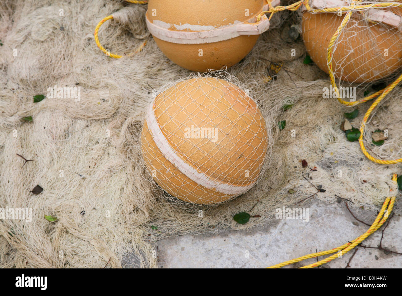 Fishing net and balls Stock Photo - Alamy