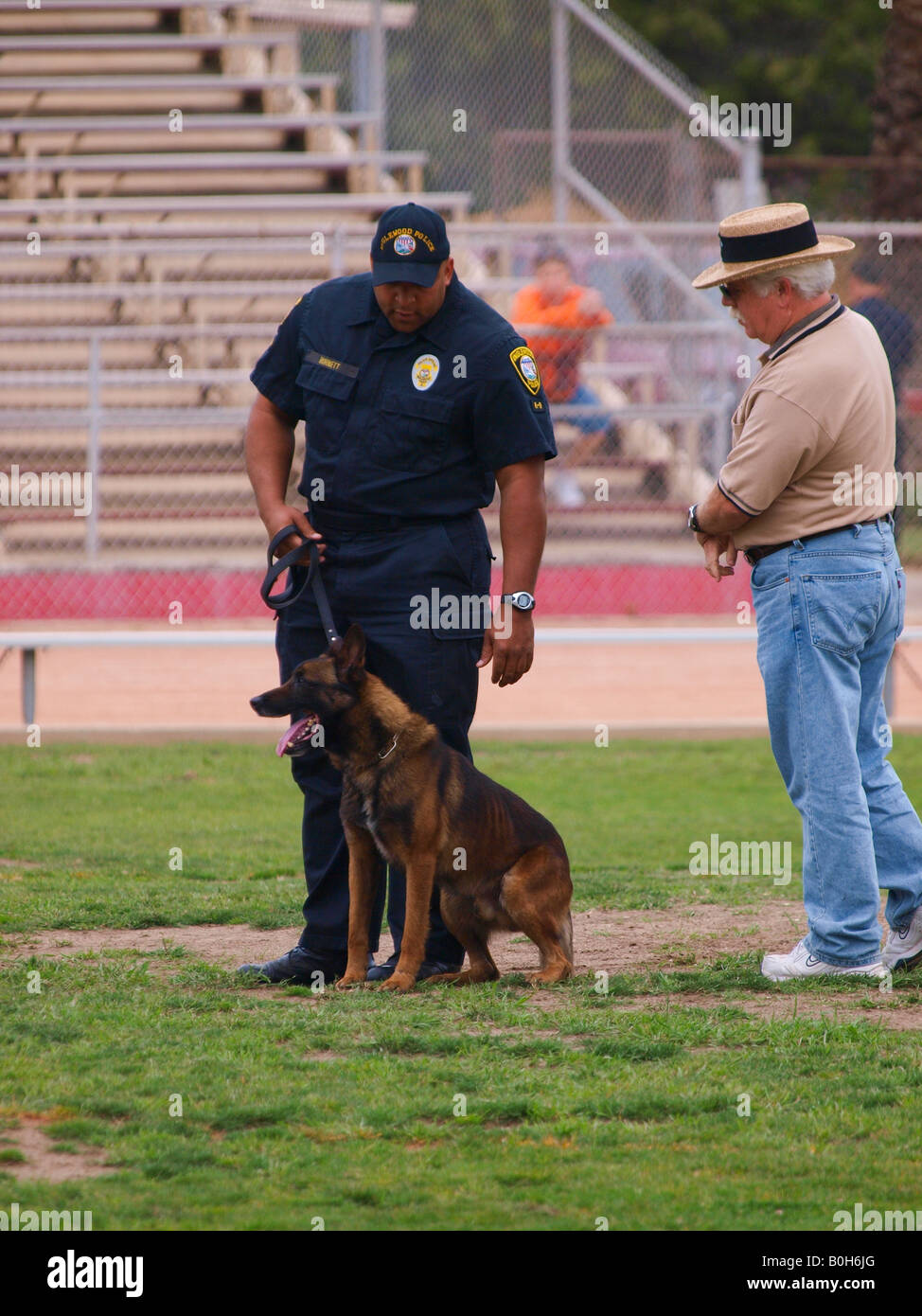 African American police officer receives instruction from judge before ...