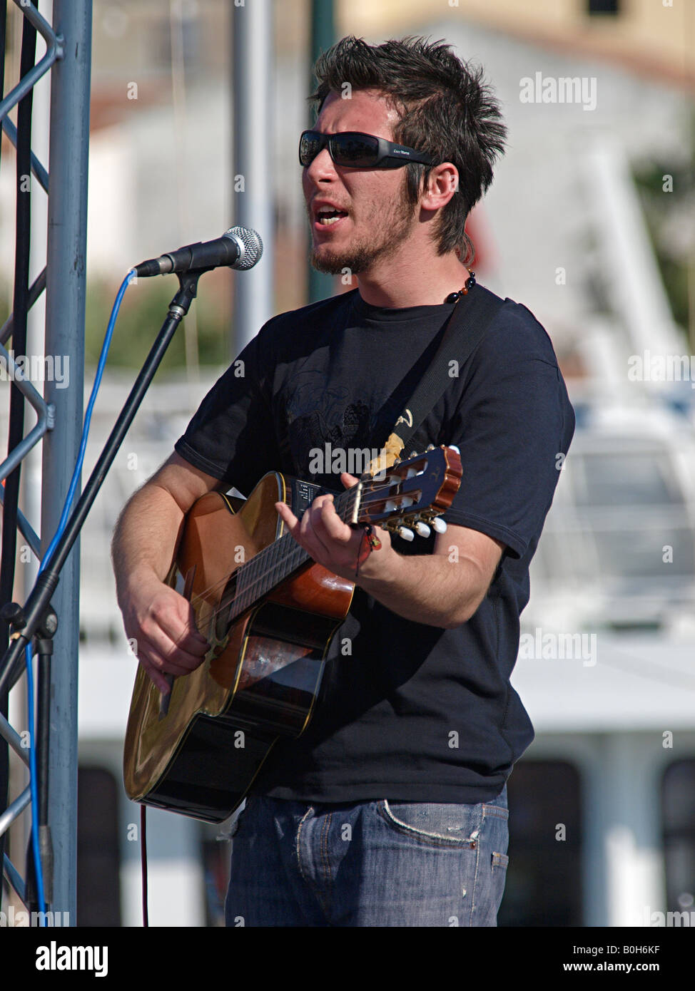 MALE SINGER AND GUITAR PLAYER PERFORMS AT FESTIVAL IN MARMARIS TURKEY ...