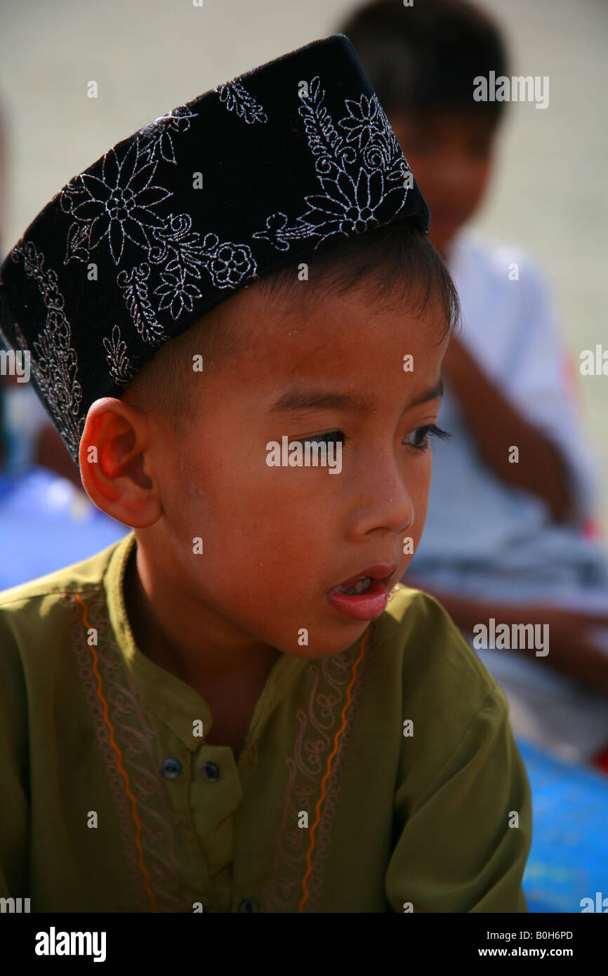 koh samui, little muslim boy outside mosgue on eid ul fitr festival ...
