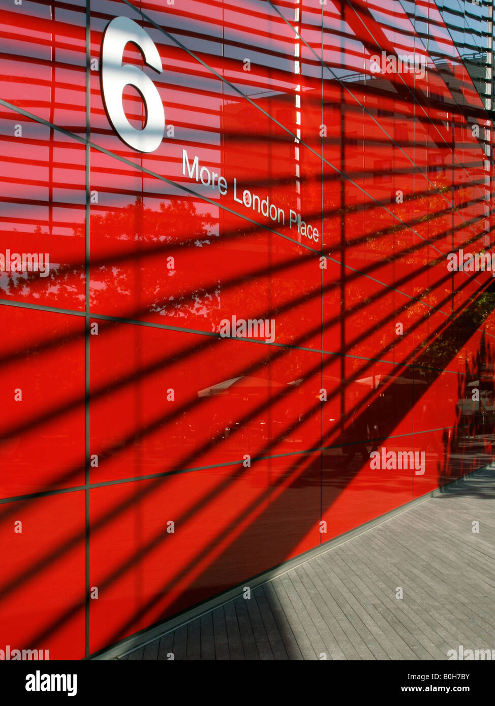 Shadows from louvres on the bright red facade of 6 More London Place ...