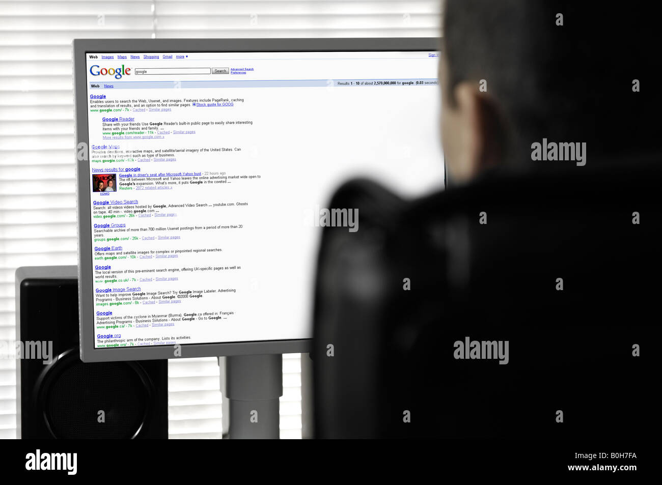 Person in front of a computer monitor Stock Photo - Alamy