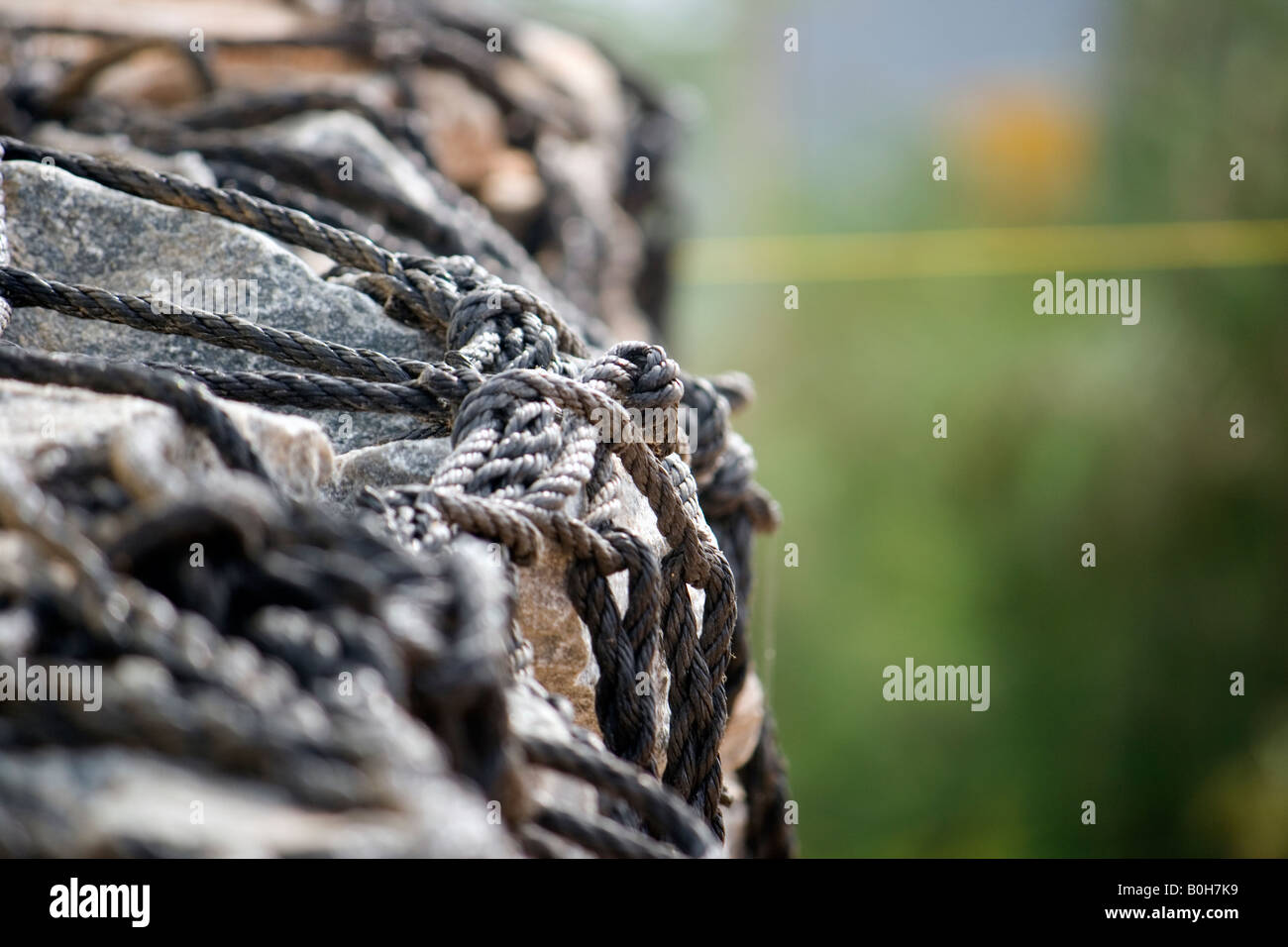Rocks tied up with ropes Stock Photo - Alamy