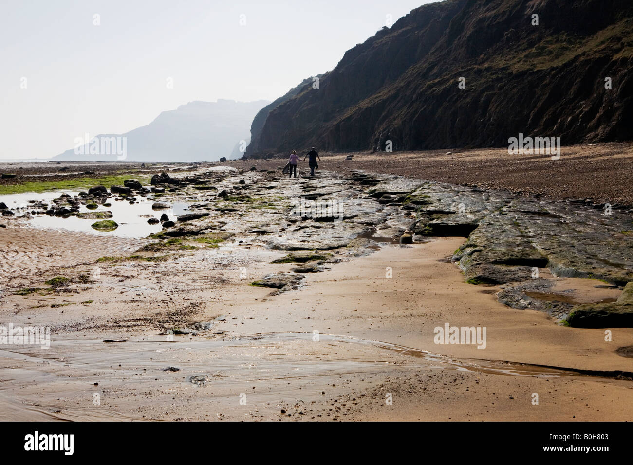 View of a deserted beach looking towards Ravenscar near Whitby ...