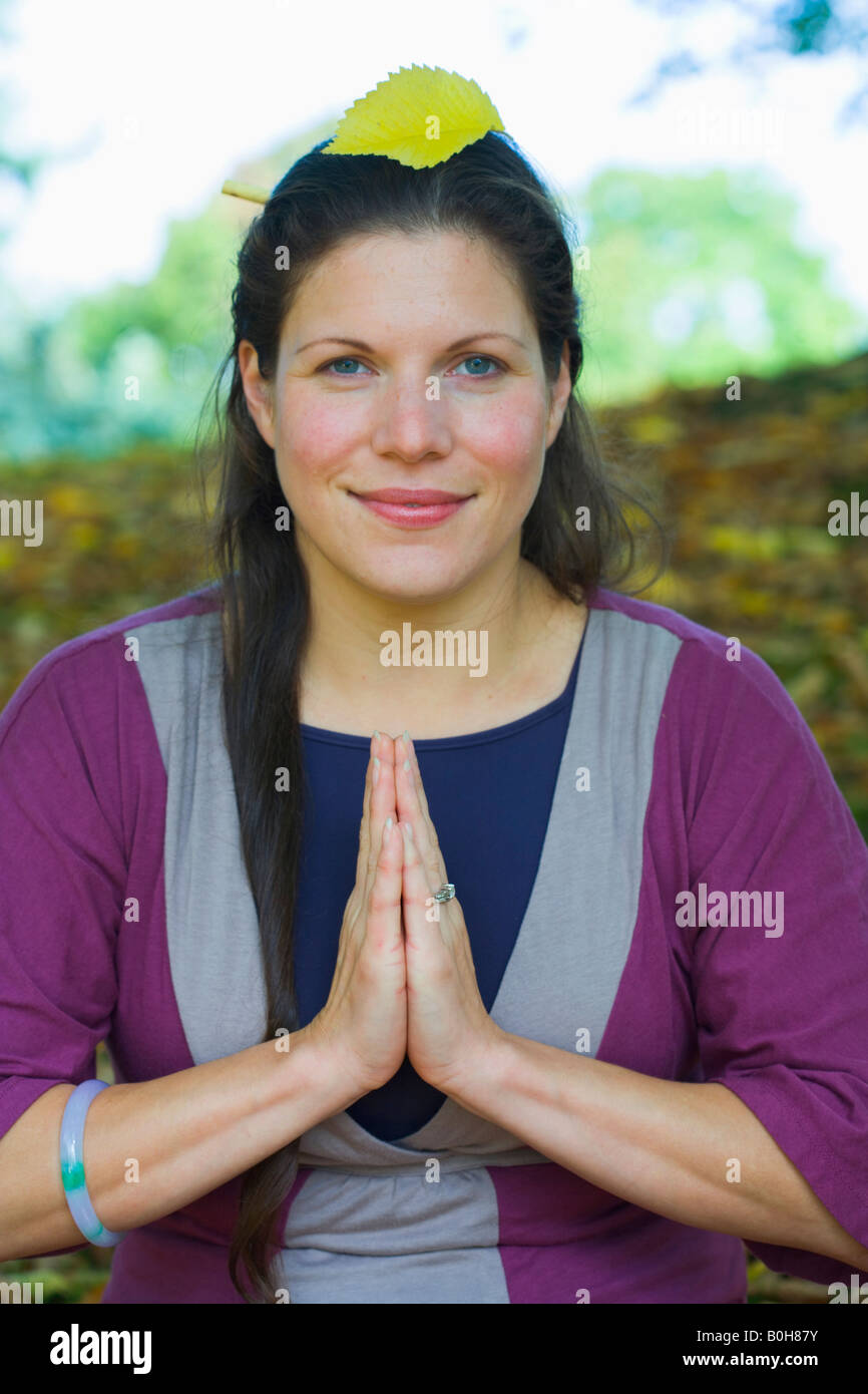 A woman in prayer Stock Photo - Alamy