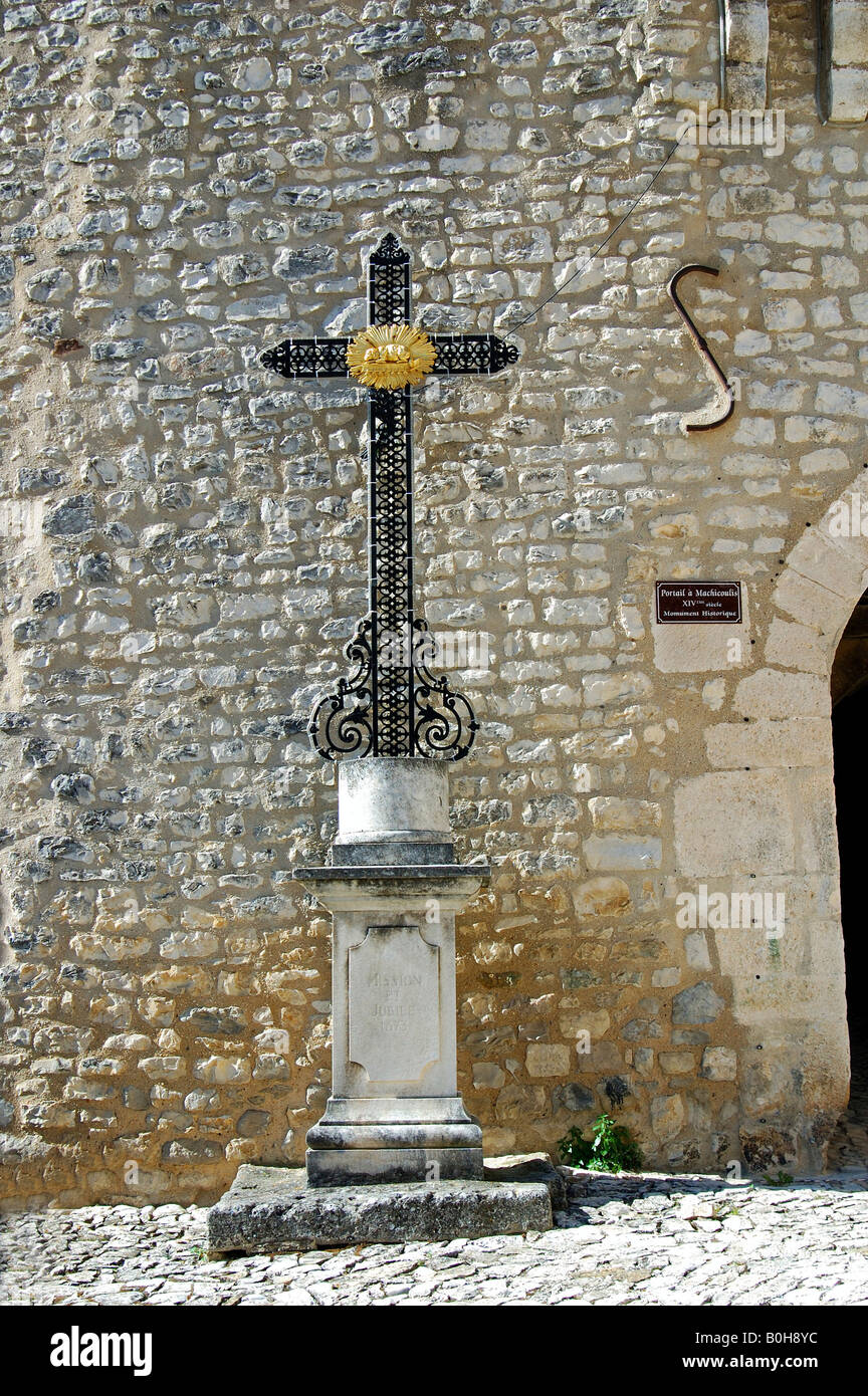 Cross in front of an entrance portal, Banon, Provence, France Stock ...