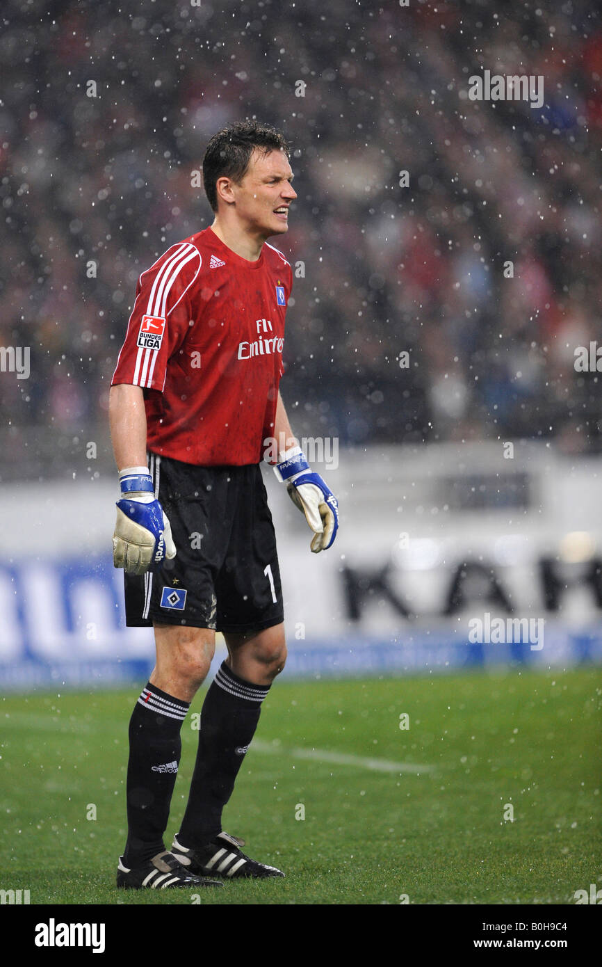 Goalkeeper Timo Rost, Hamburger SV football club, standing in the rain ...
