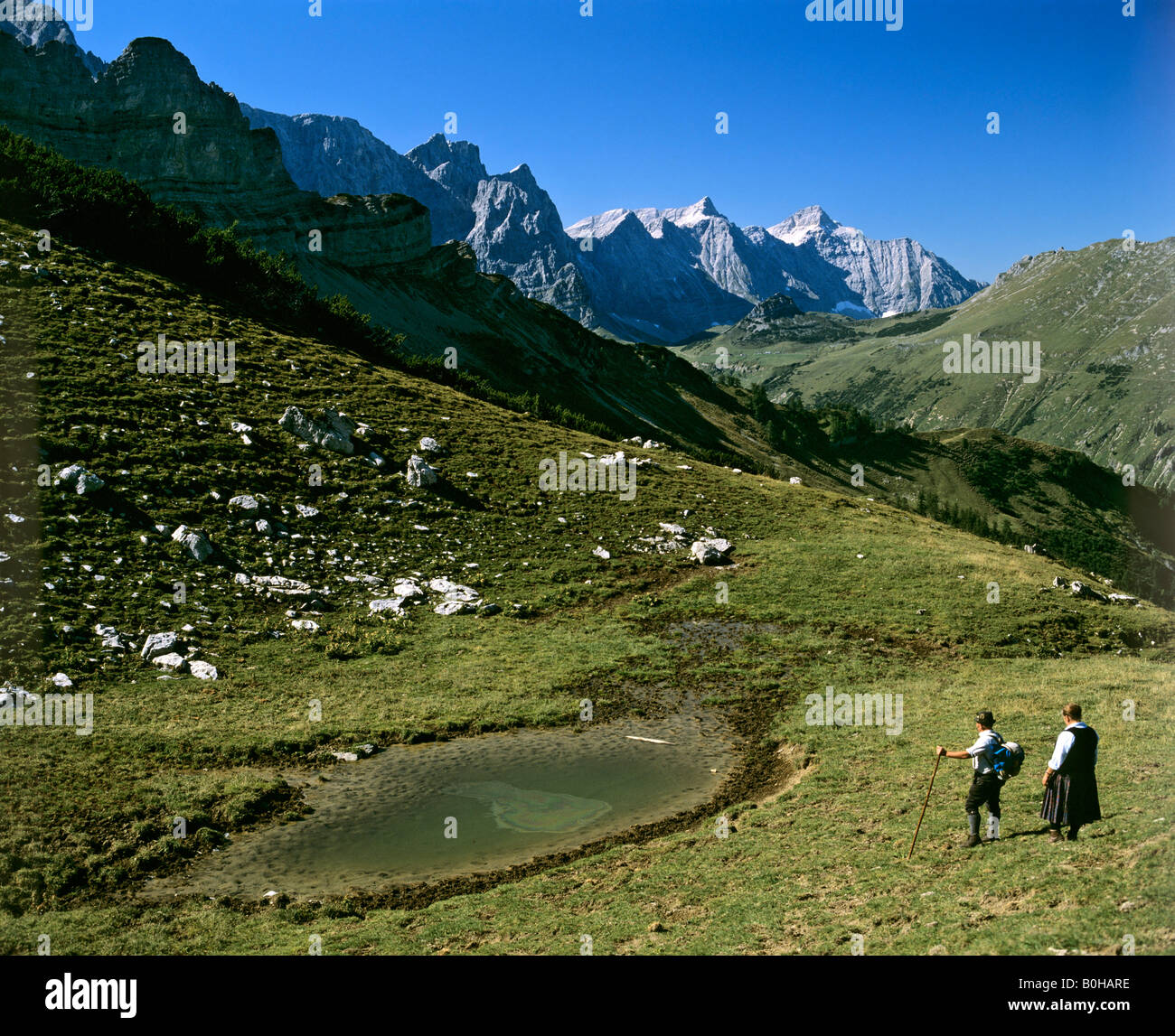 Hikers along the Gramaijoch Pass, Karwendel Range, Upper Bavaria ...