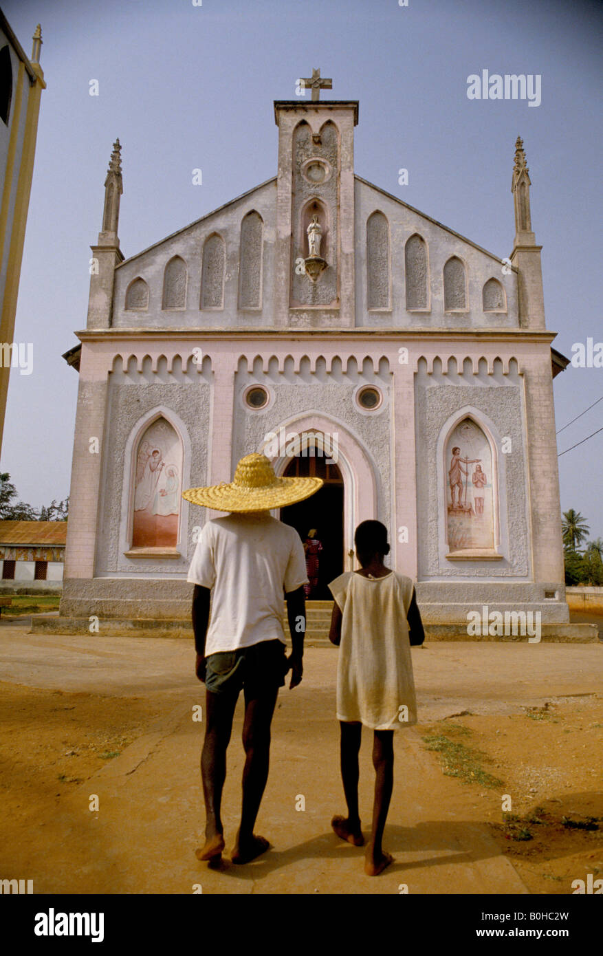 Two boys standing in front of a church, Togo Stock Photo - Alamy