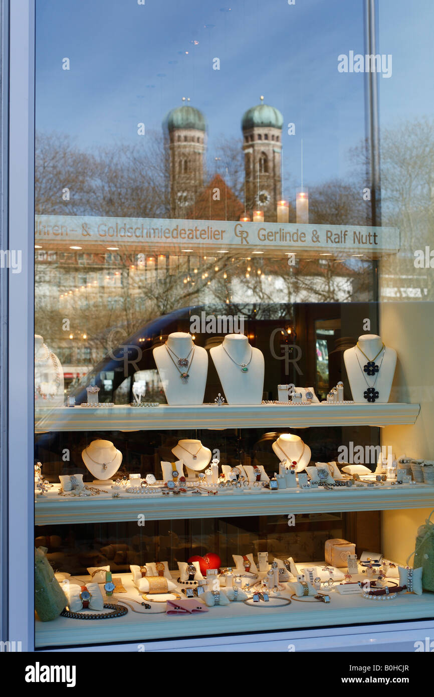 Frauenkirche church towers reflected in the window display of the ...