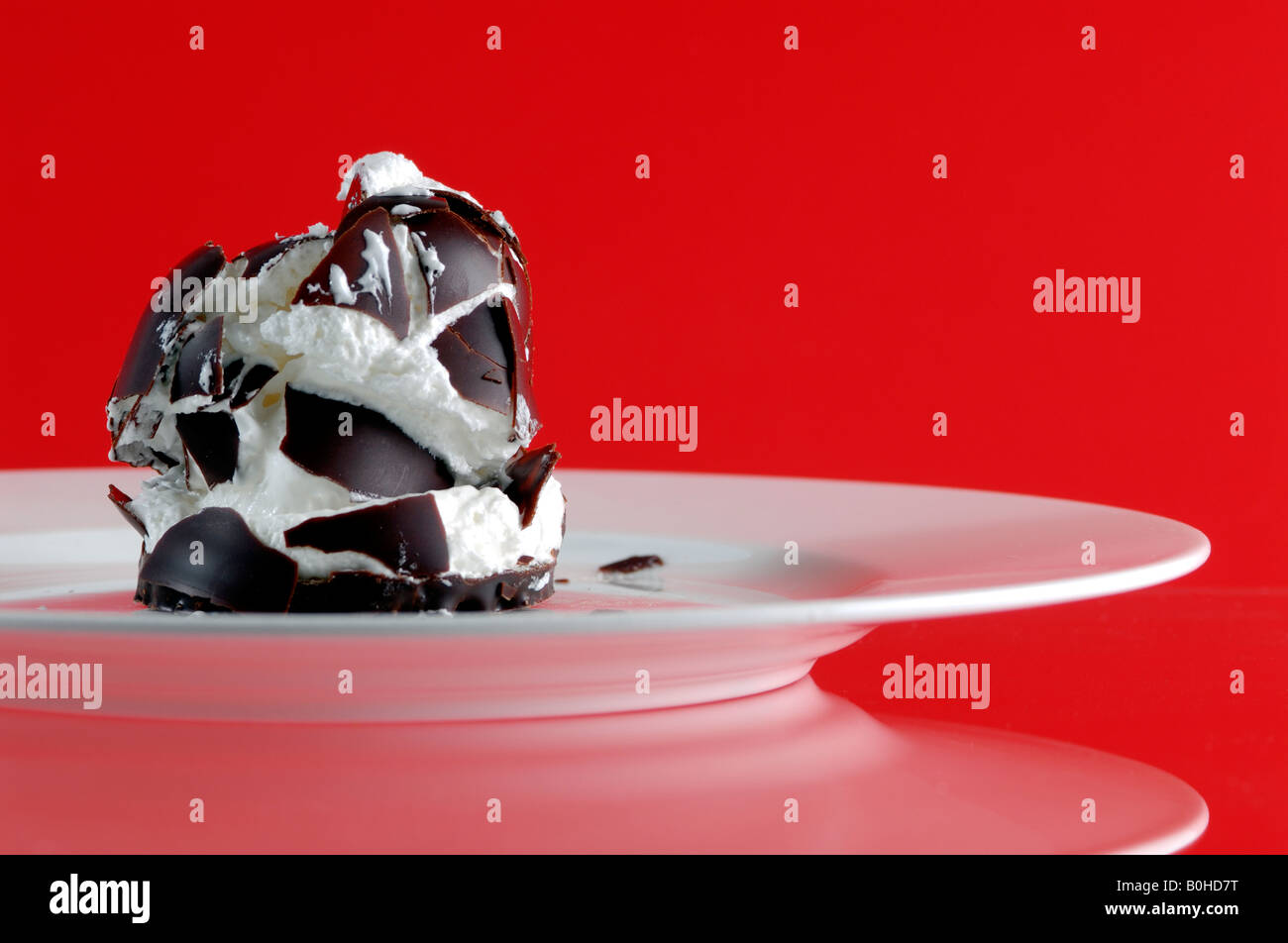 Damaged small chocolate-covered cream cake: diet and frustration Stock ...