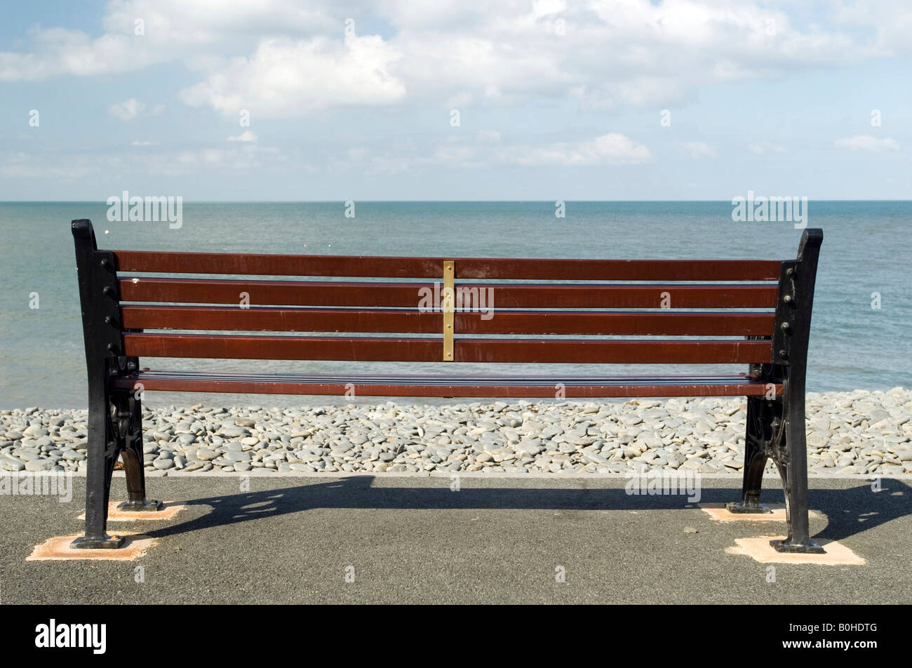Bench overlooking the sea, pebble beach Stock Photo - Alamy