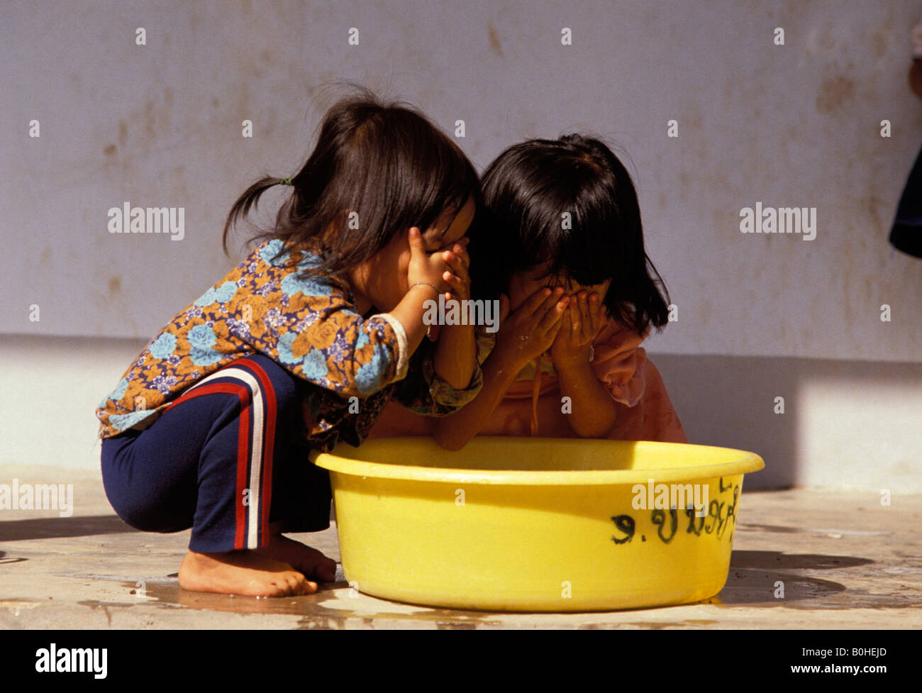 Washing faces hi-res stock photography and images - Alamy