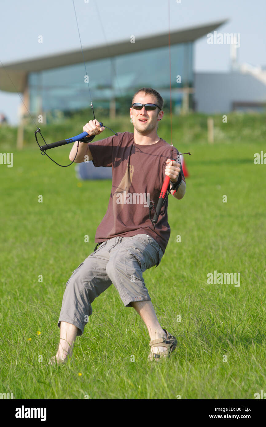 Man flying a kite Stock Photo - Alamy