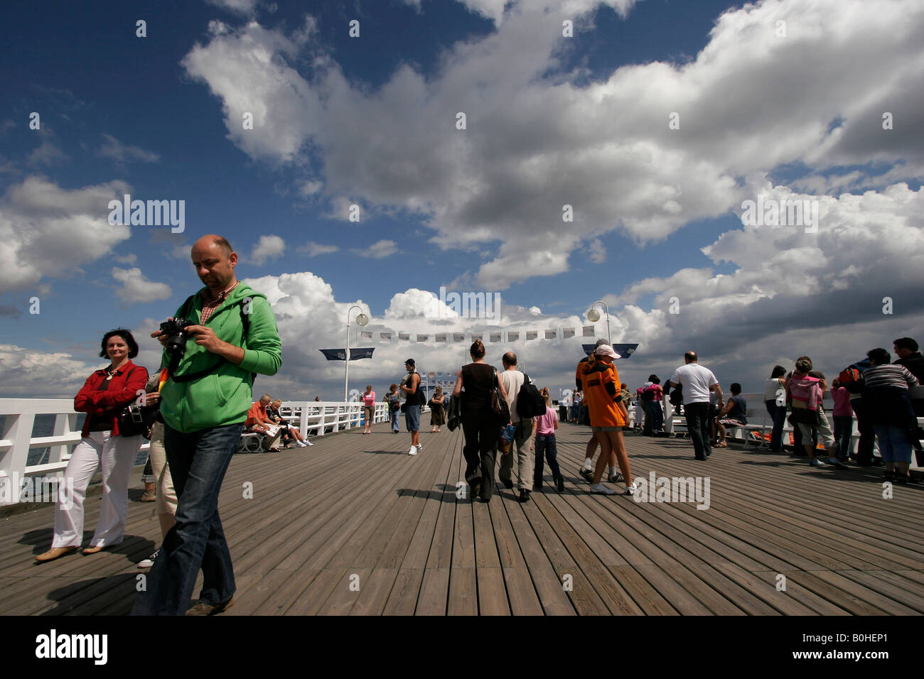 Tourist walking over a wooden bridge in Sopot, Baltic Sea coast, Poland ...