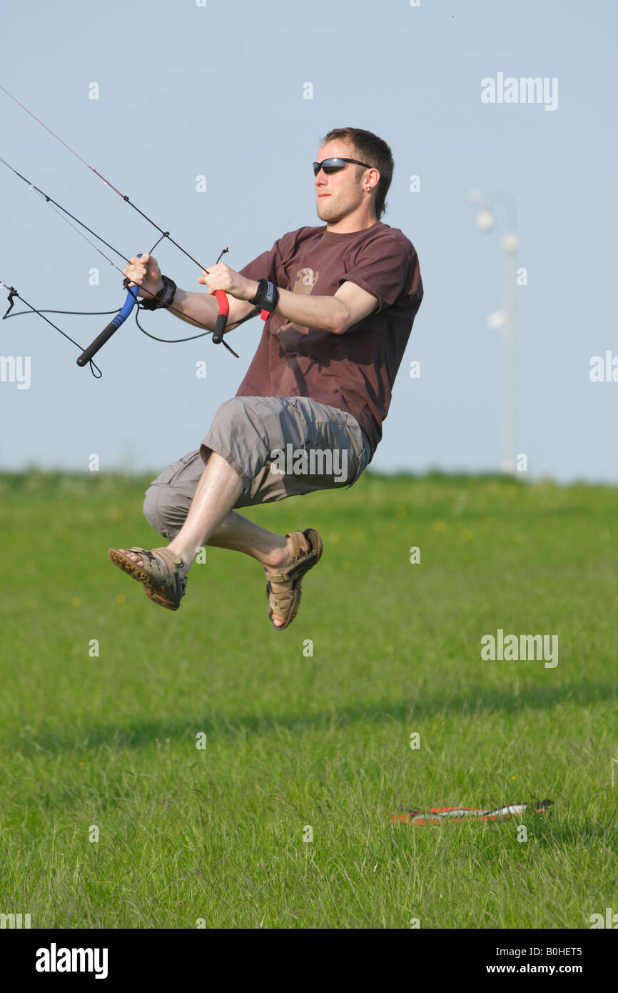 Man flying a kite Stock Photo - Alamy