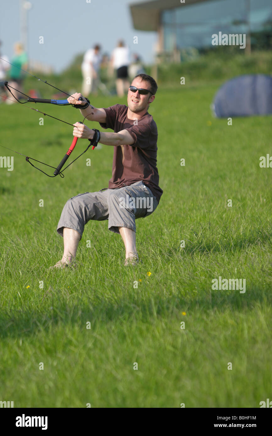 Man flying a kite Stock Photo - Alamy