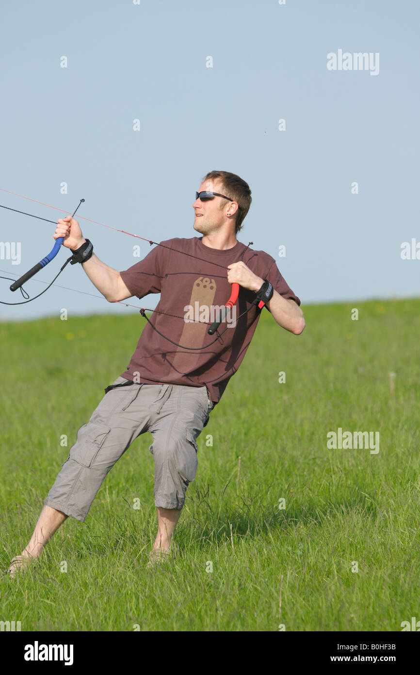 Man flying a kite Stock Photo - Alamy