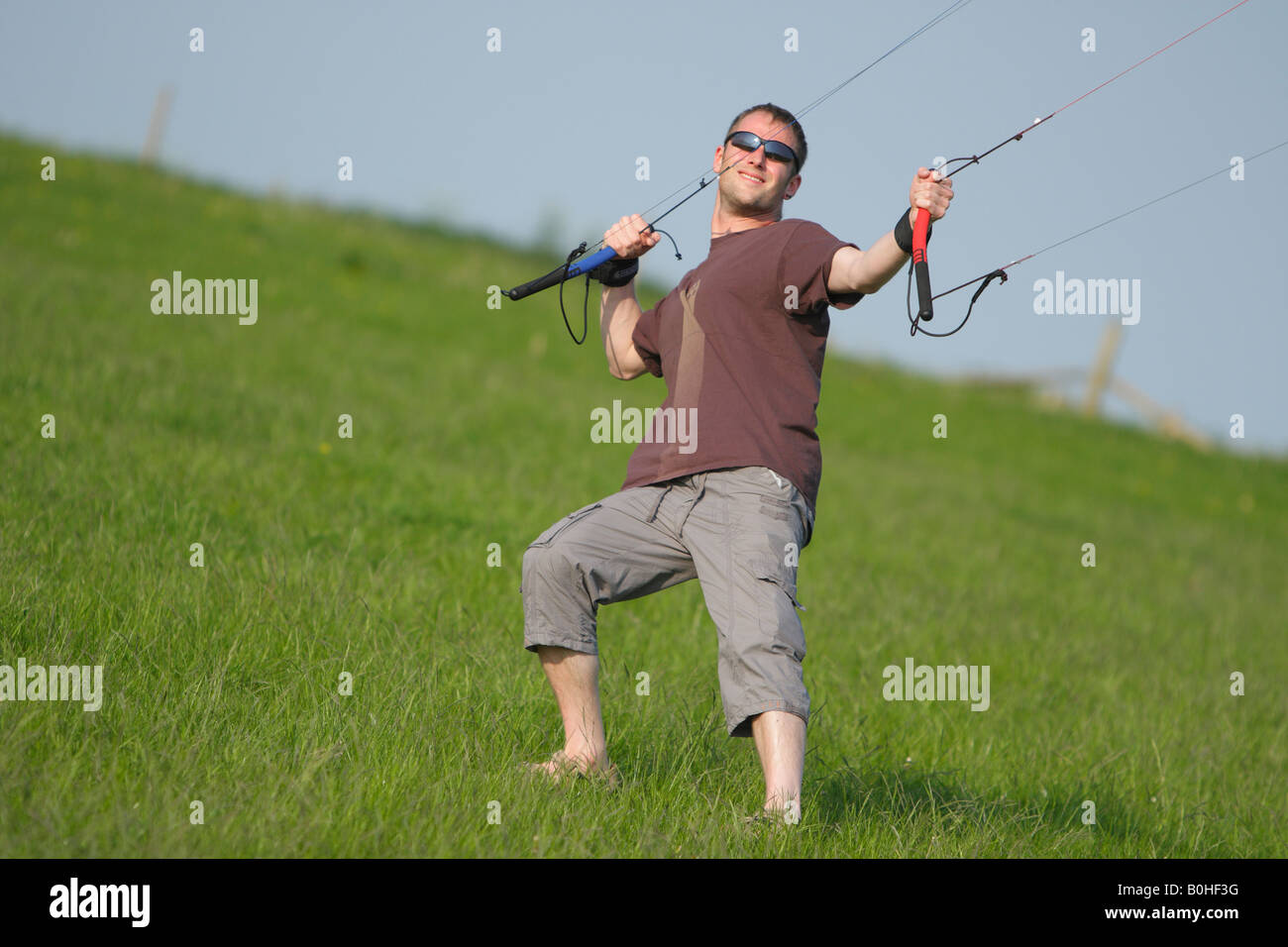 Man flying a kite Stock Photo - Alamy