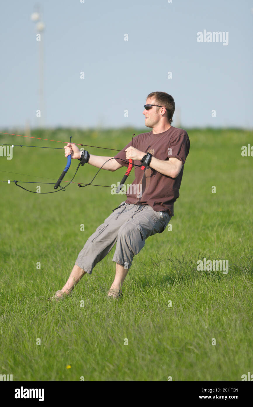 Man flying a kite Stock Photo - Alamy