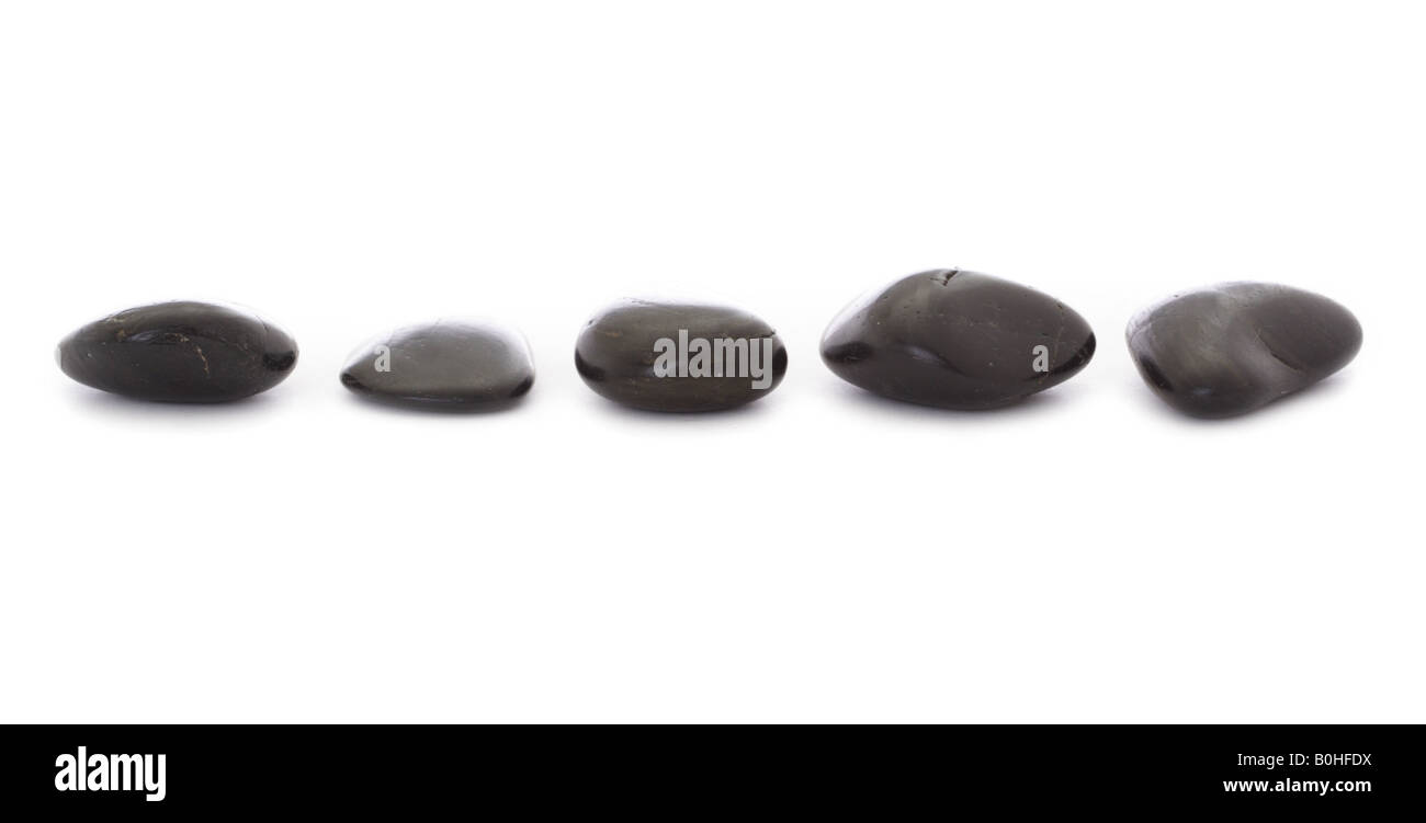 four black stepping stones in a row Stock Photo - Alamy