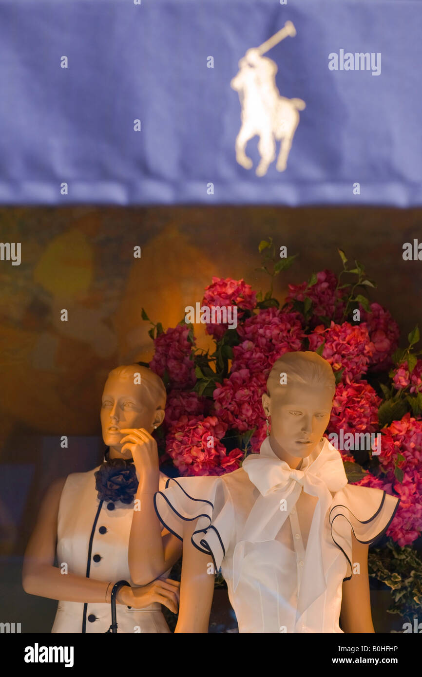 Elegantly dressed female mannequins in the window display of the Polo ...