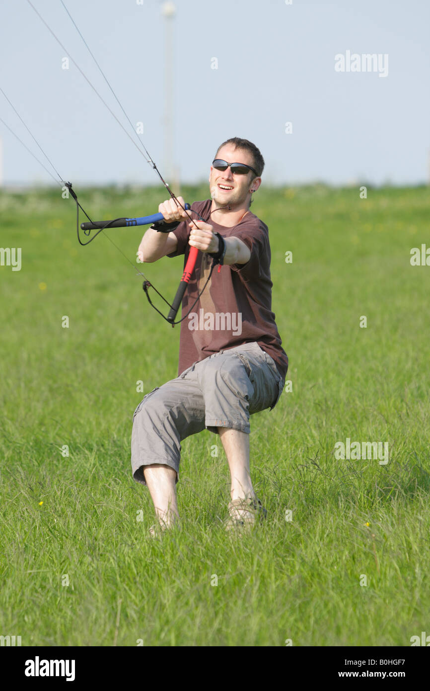 Man flying a kite Stock Photo - Alamy
