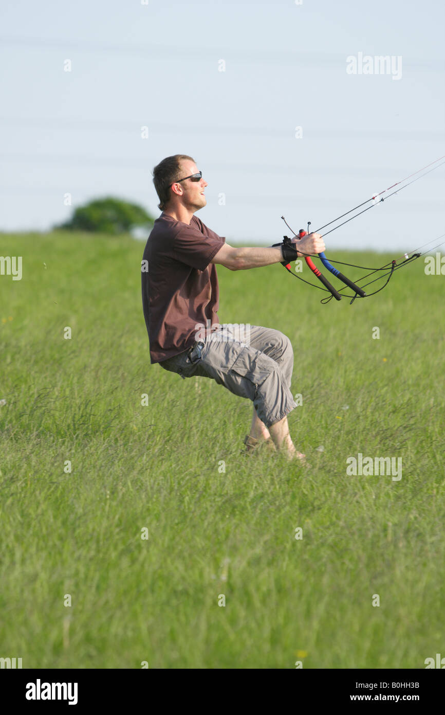 Man flying a kite Stock Photo - Alamy