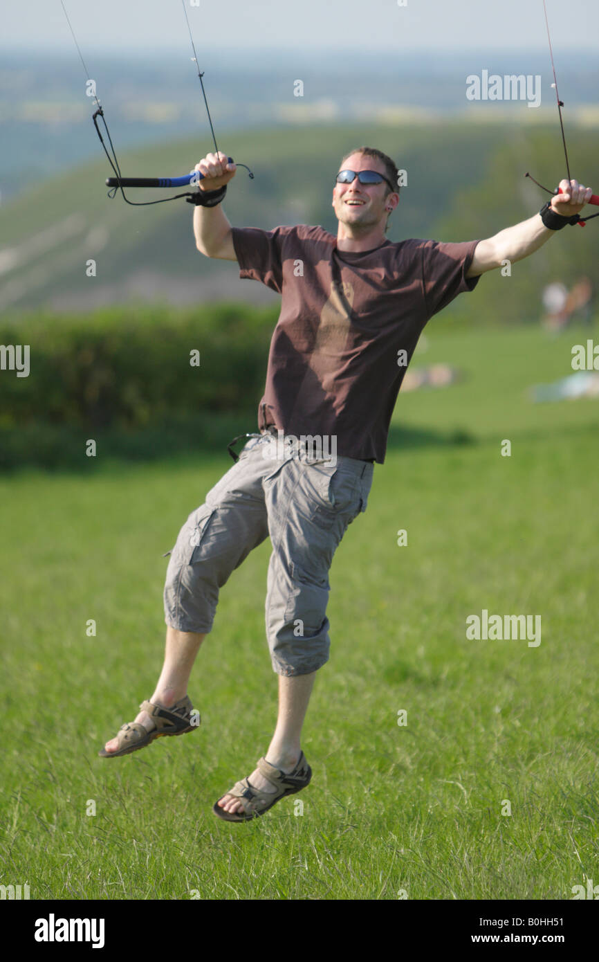 Man flying a kite Stock Photo - Alamy