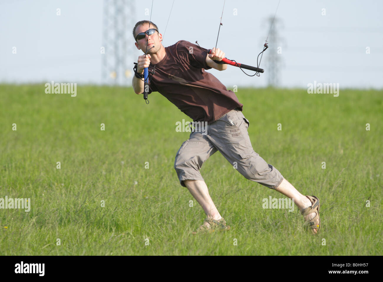 Man flying a kite Stock Photo - Alamy