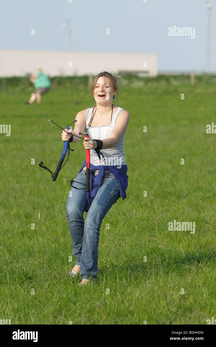 Woman flying a kite Stock Photo - Alamy