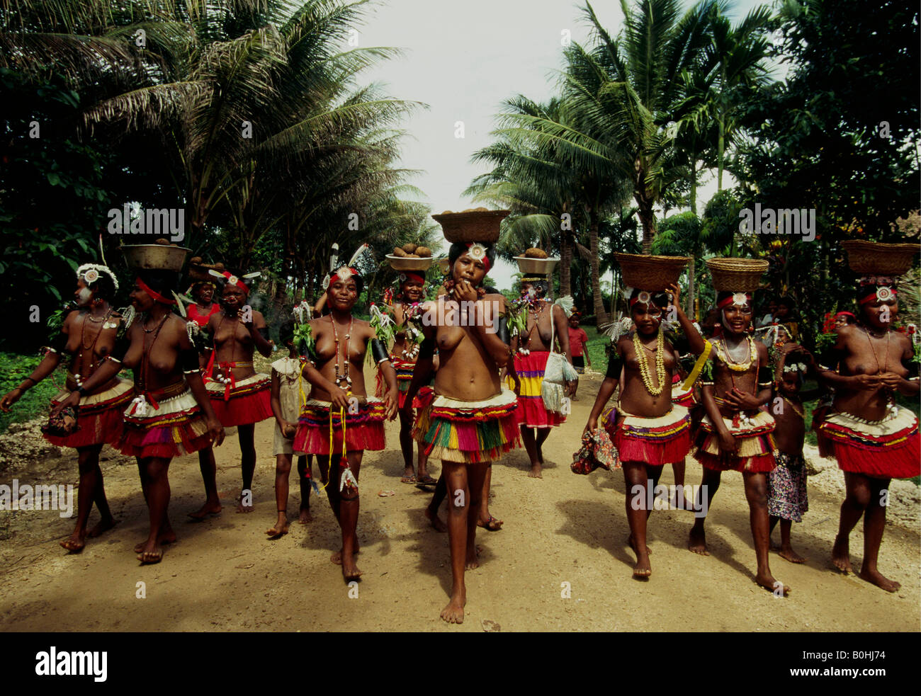 Woman taking part in the Tapioca dance during the Yam Harvest Festival ...
