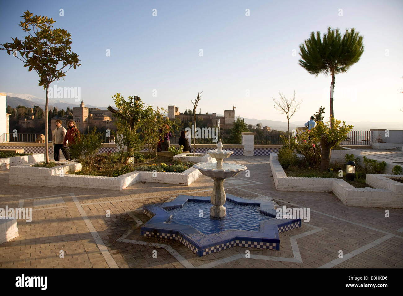 Fountain and trees of the Mezquita Grande mosque garden, El Albayzín or ...