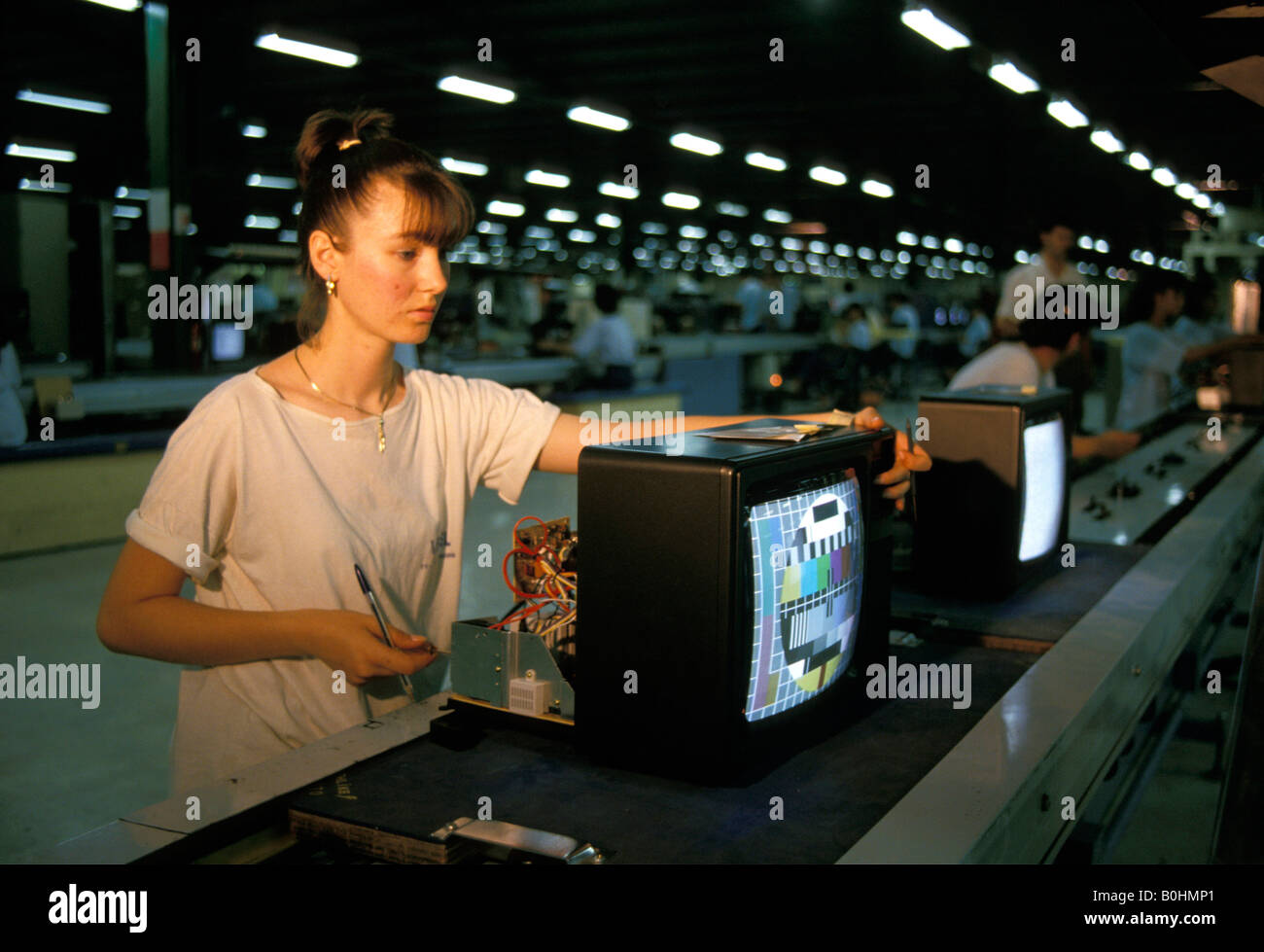 A woman working on a television assembly line, Turkey Stock Photo - Alamy