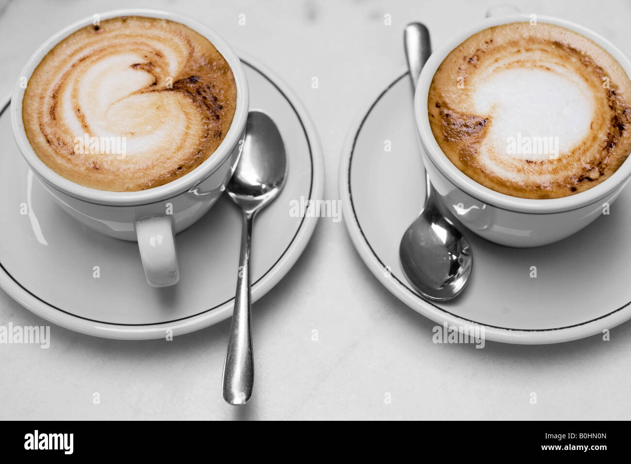 Two cups of cappuccino Stock Photo - Alamy