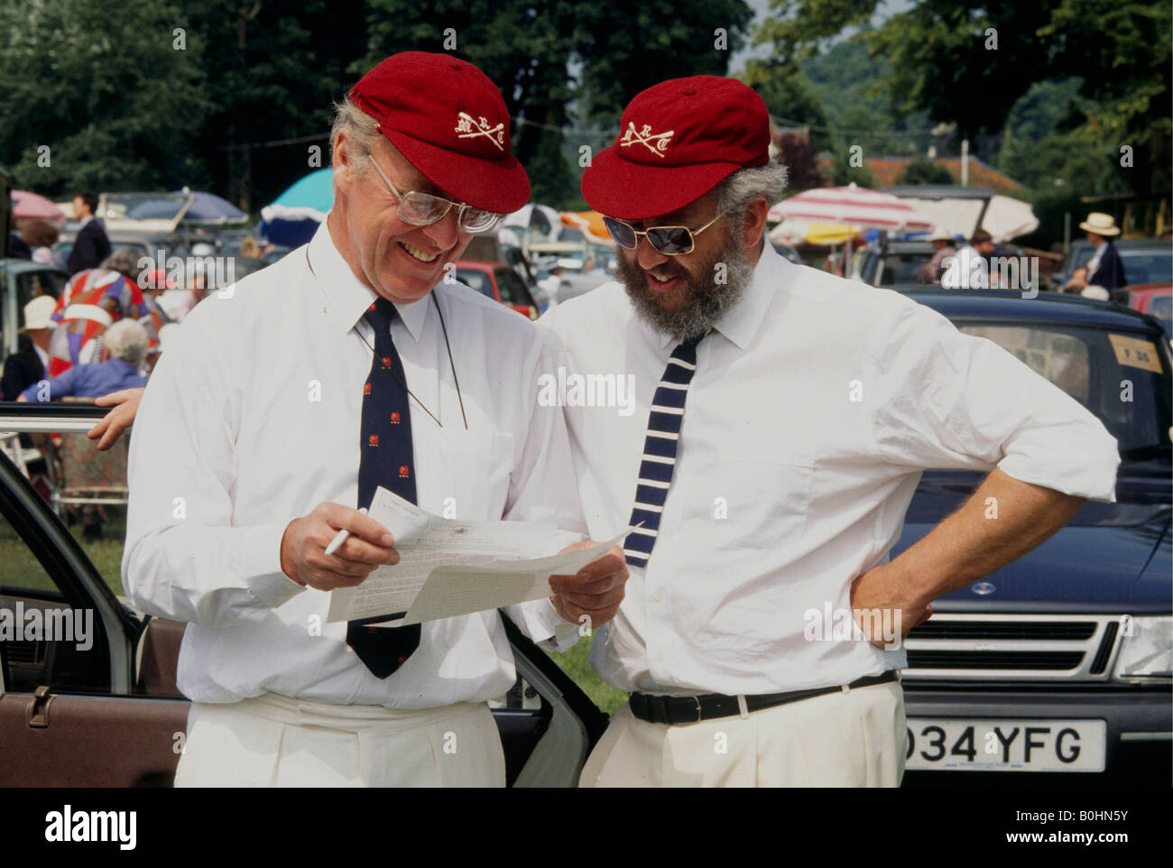 Two cap-wearing spectators at Henley Royal Regatta, Henley-on-Thames ...